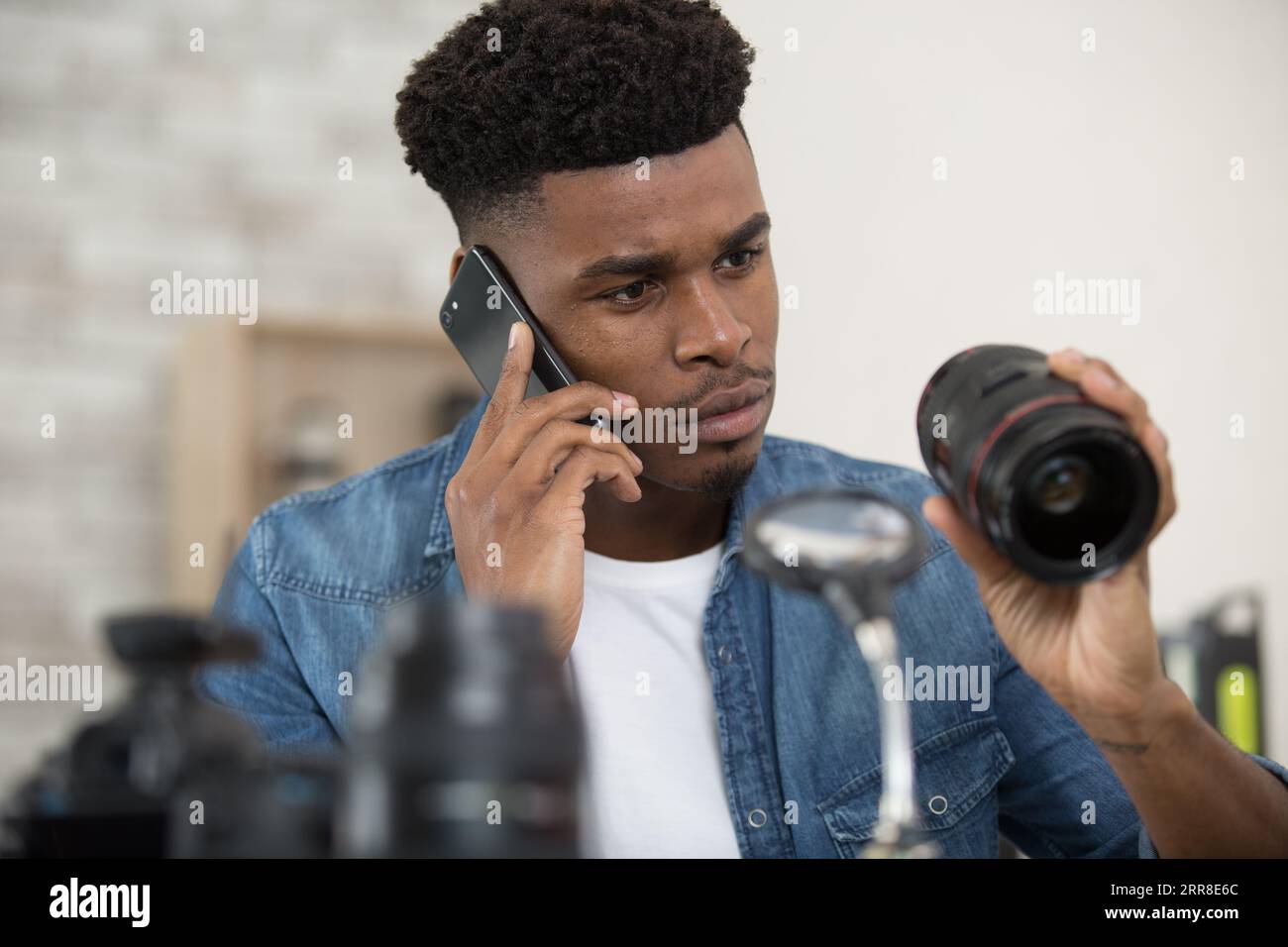 young photographer calling for assistance Stock Photo - Alamy