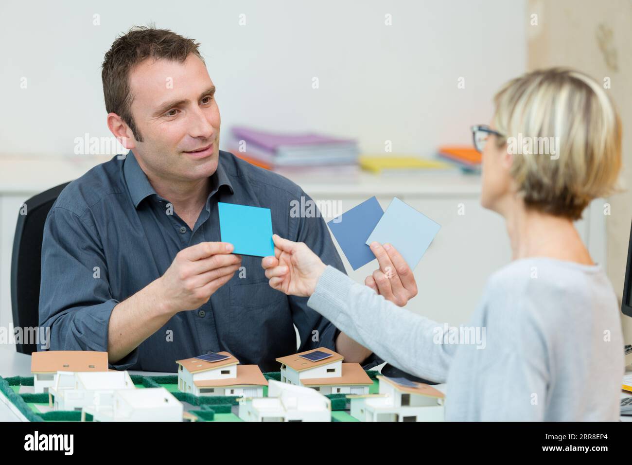 female architect in consultation with client Stock Photo - Alamy