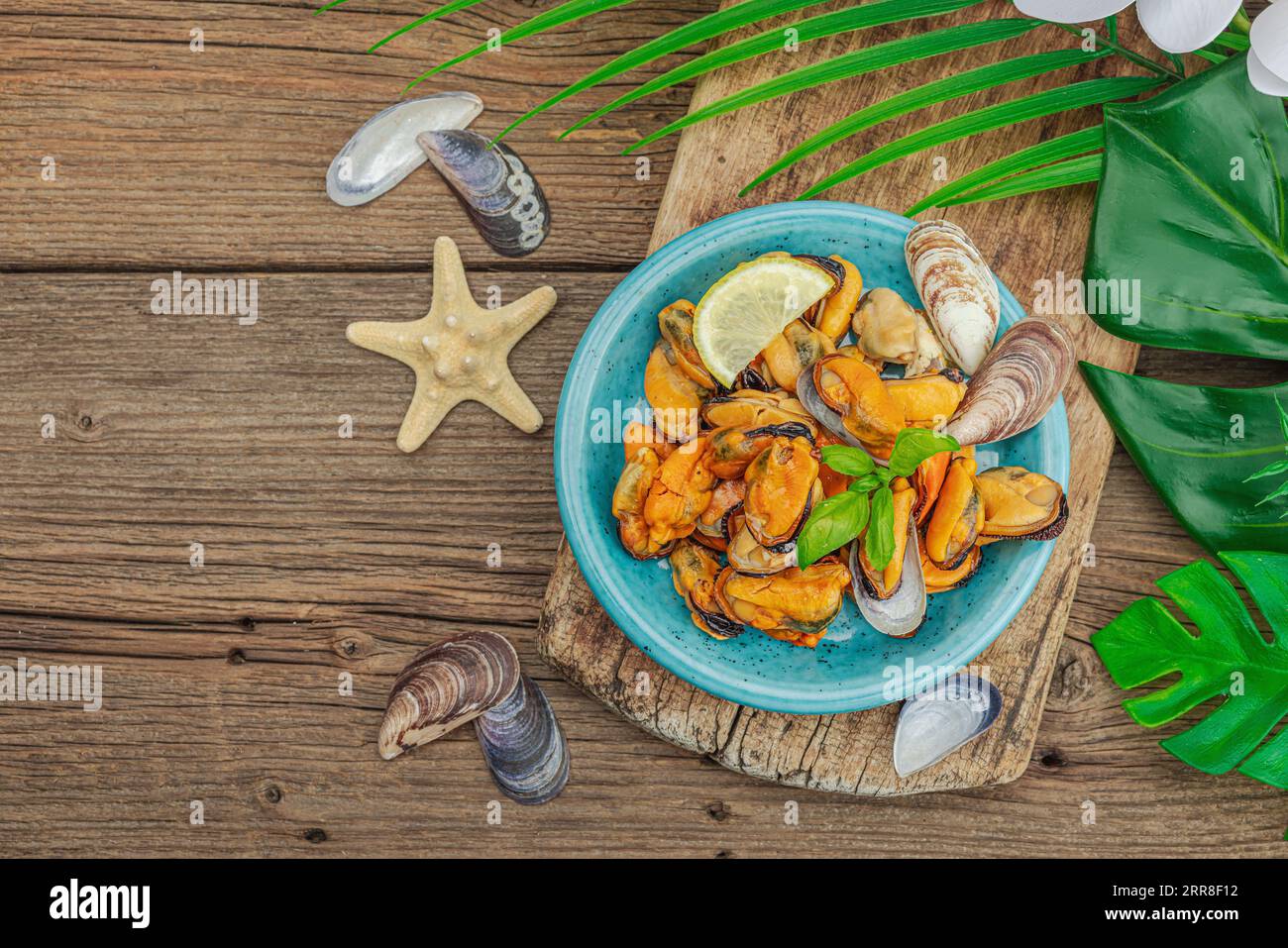 Mussels with oil, spices and greens. Healthy seafood is rich in omega ...