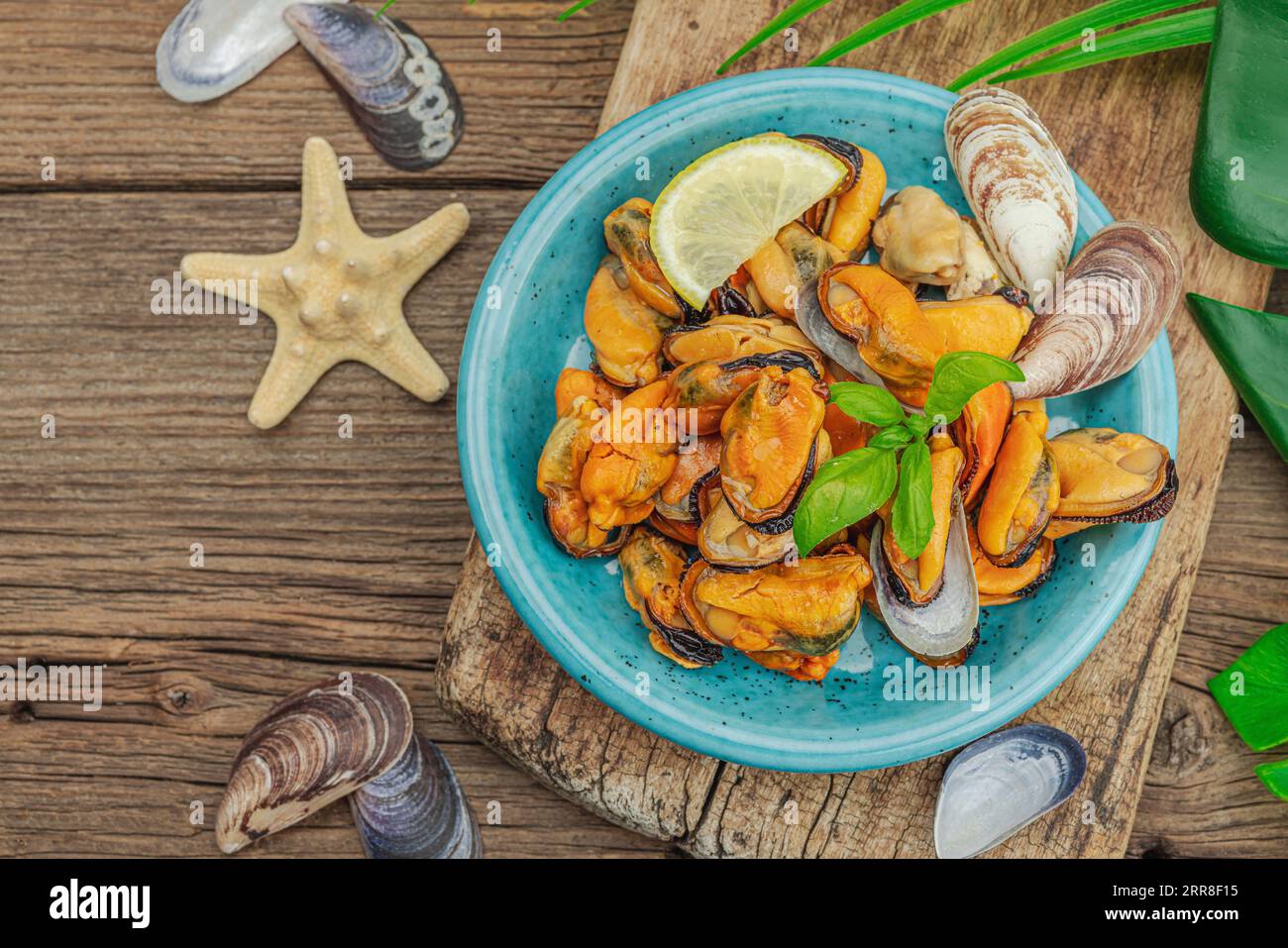 Mussels with oil, spices and greens. Healthy seafood is rich in omega ...