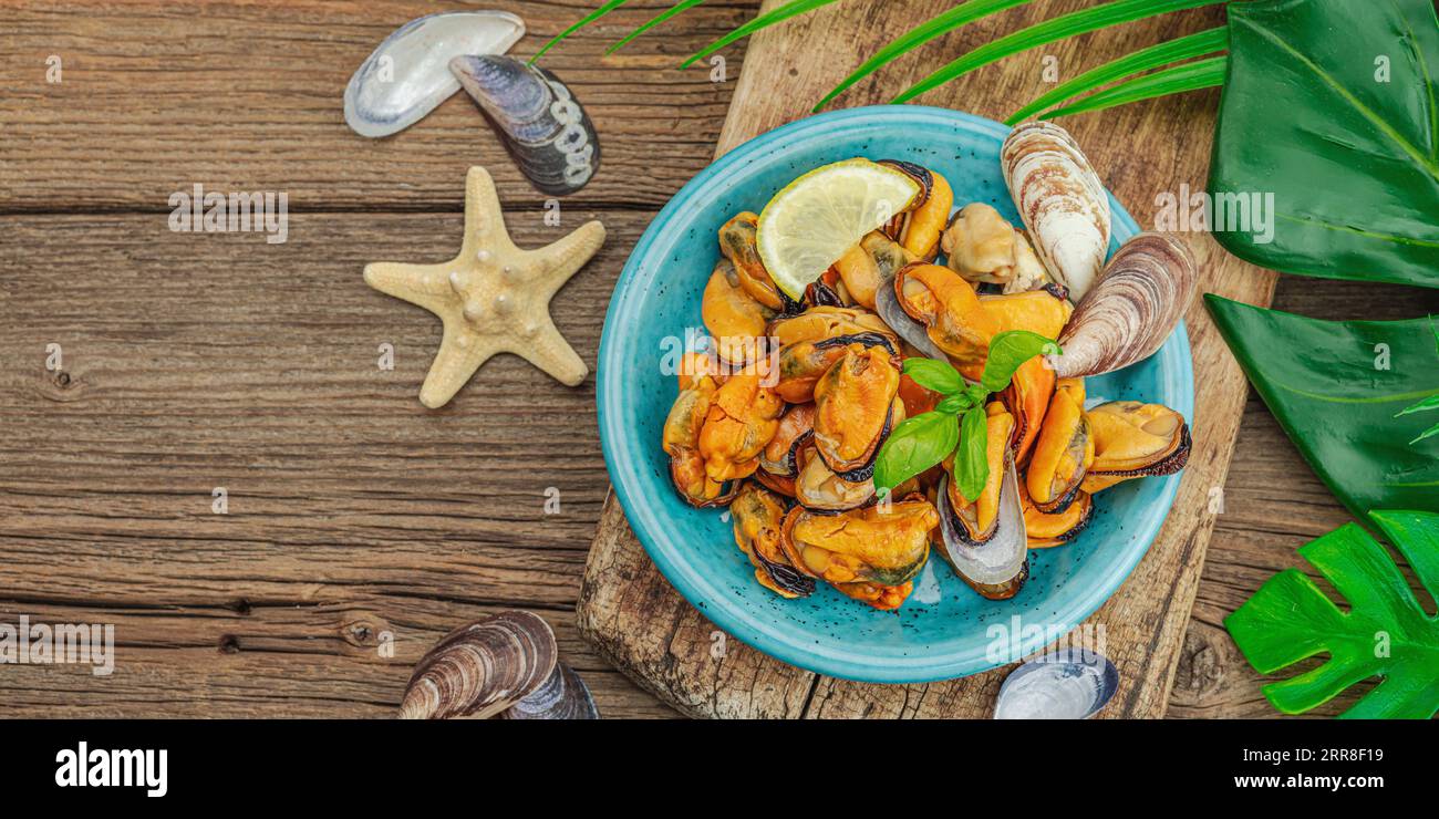 Mussels with oil, spices and greens. Healthy seafood is rich in omega ...