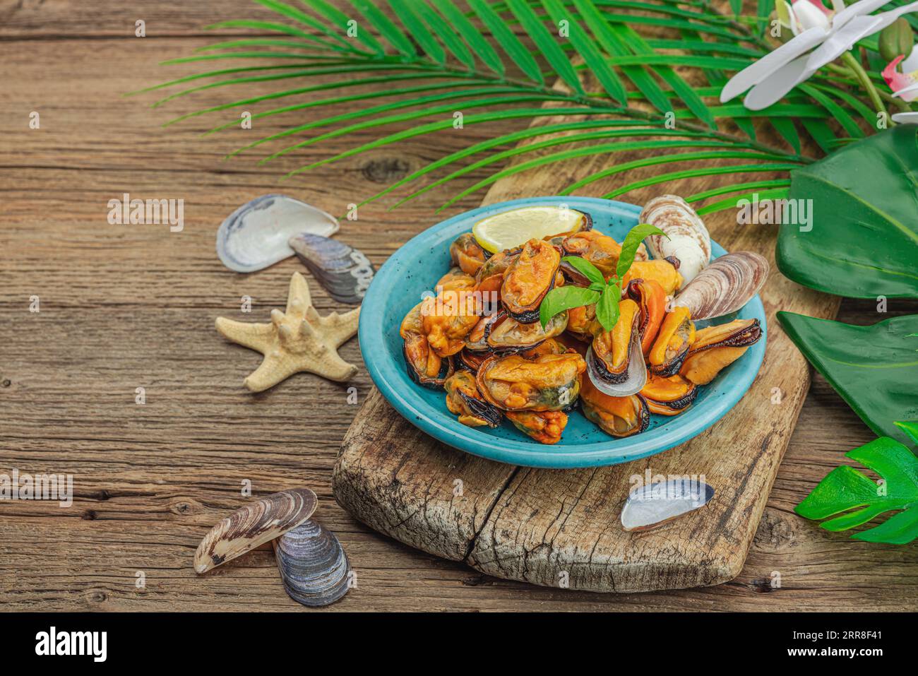 Mussels with oil, spices and greens. Healthy seafood is rich in omega ...