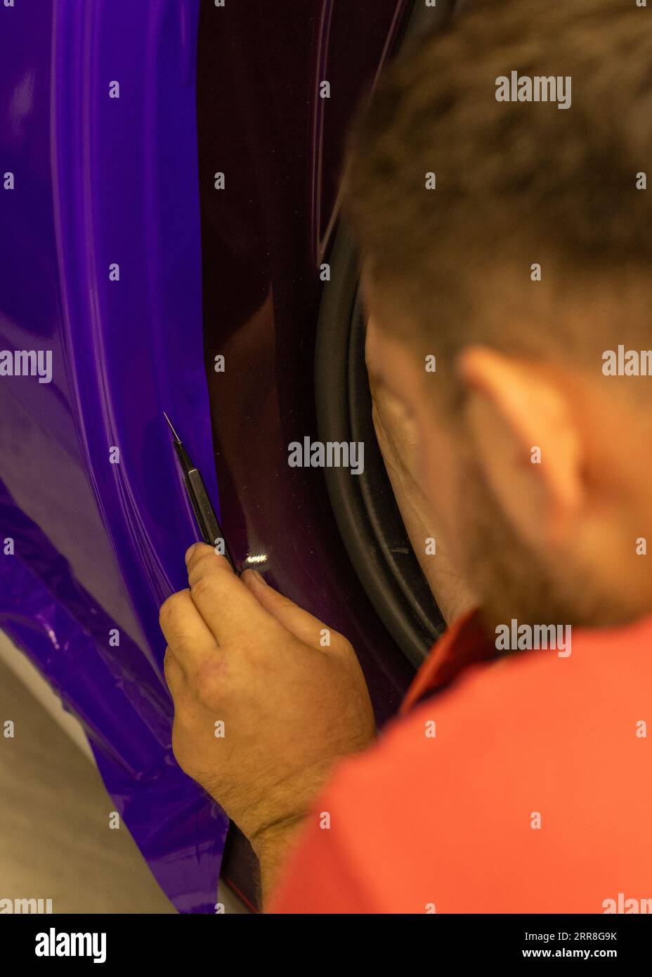 Purple overalls hi-res stock photography and images - Alamy