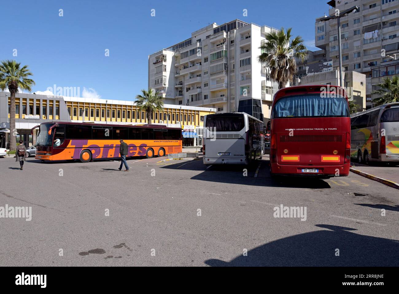 Buses waiting at the Durres bus and train station, next to the ferry ...