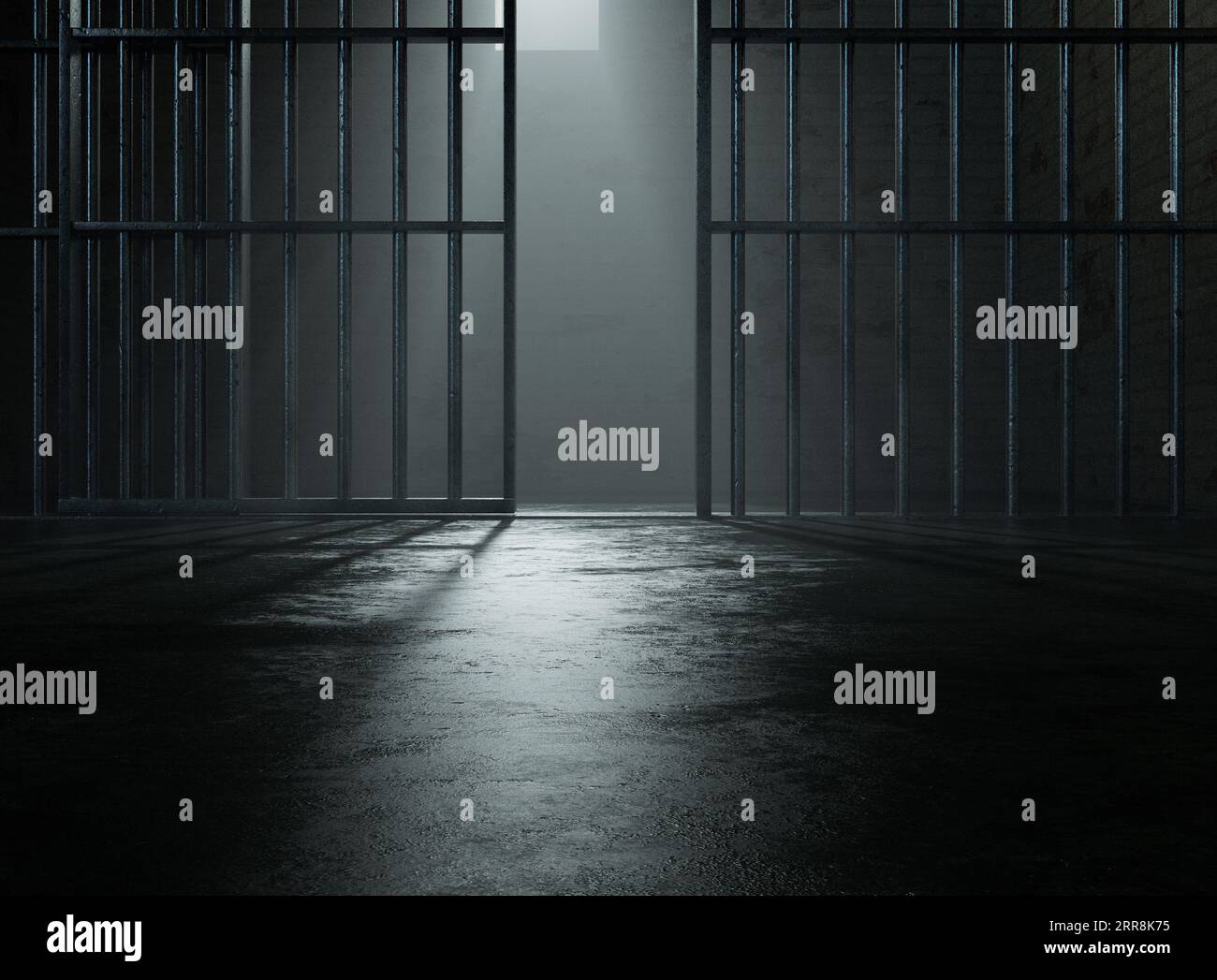 A closeup of a spolight behind jail cells iron bars casting shadows on the concrete prison floor ...