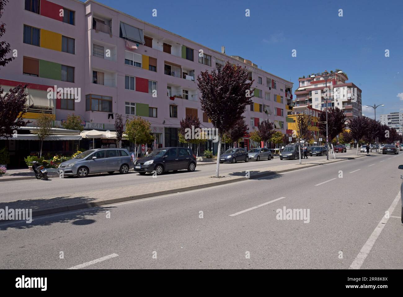 Colourful painted apartment blocks with street art murals in the town ...