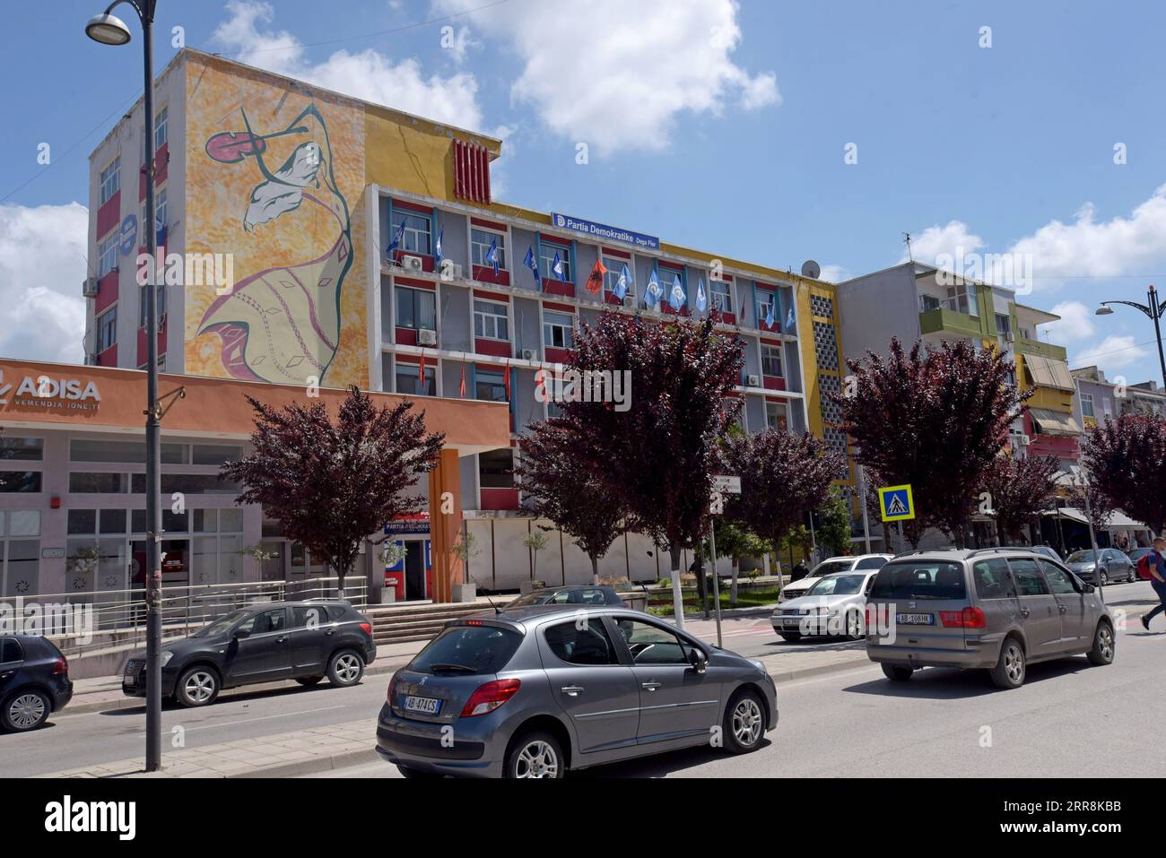 Colourful painted apartment blocks with street art murals in the town ...