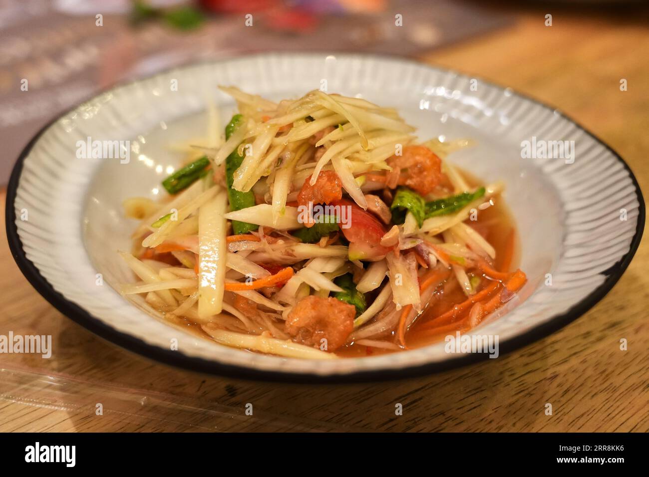 Spicy and Tangy Thai Traditional Dish 'Som Tam' Stock Photo - Alamy