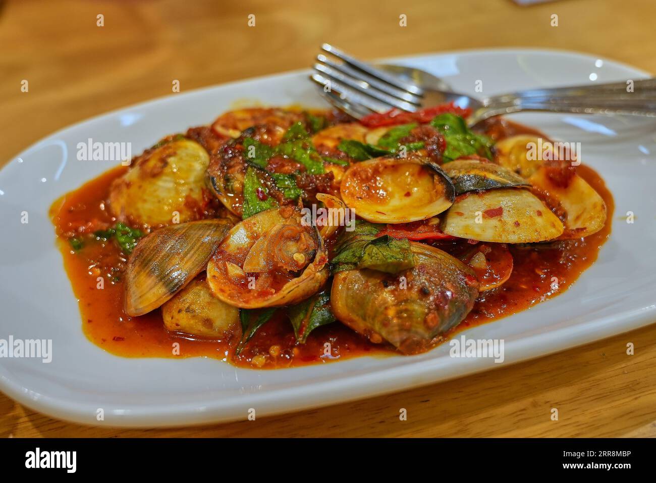 Spicy Thai Stir-Fried Clams with Chili and Vegetables Stock Photo - Alamy