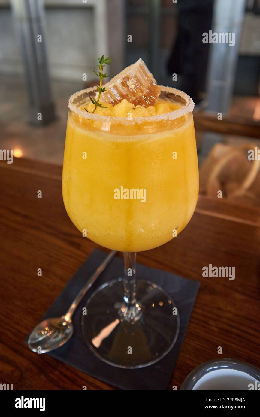Cool Mango Smoothie with Honeycomb Topping Stock Photo - Alamy