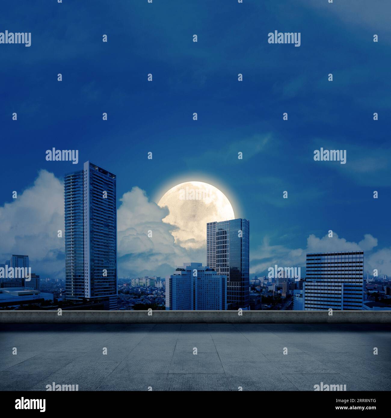 Skyscrapers and modern buildings with a full moon in the night ...