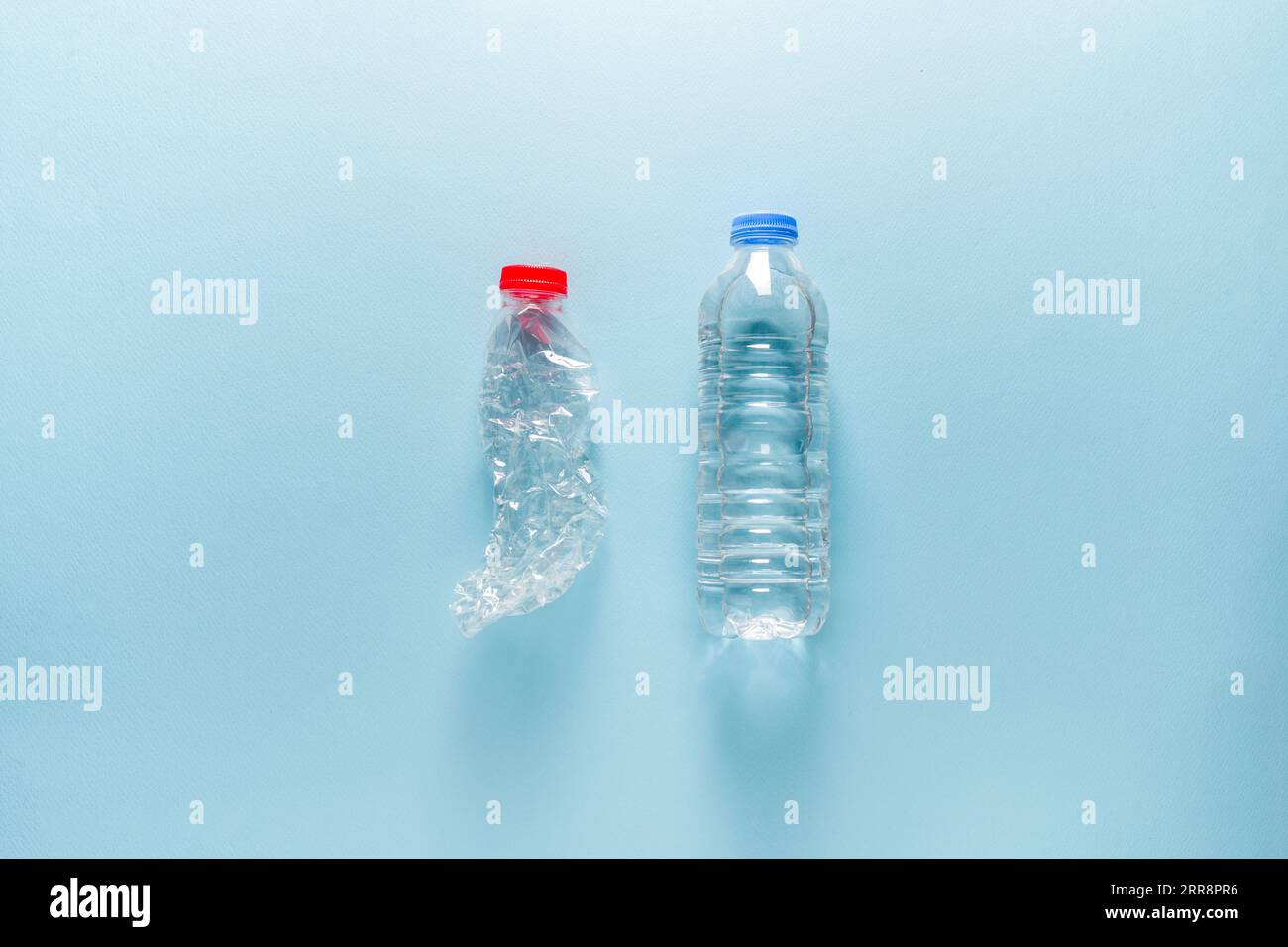 Plastic water bottle filled with empty and crushed plastic water bottle ...