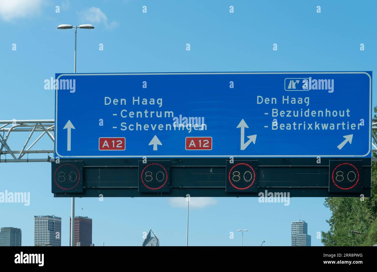 Blue traffic direction signs on the A12 motorway in The Hague, Holland ...