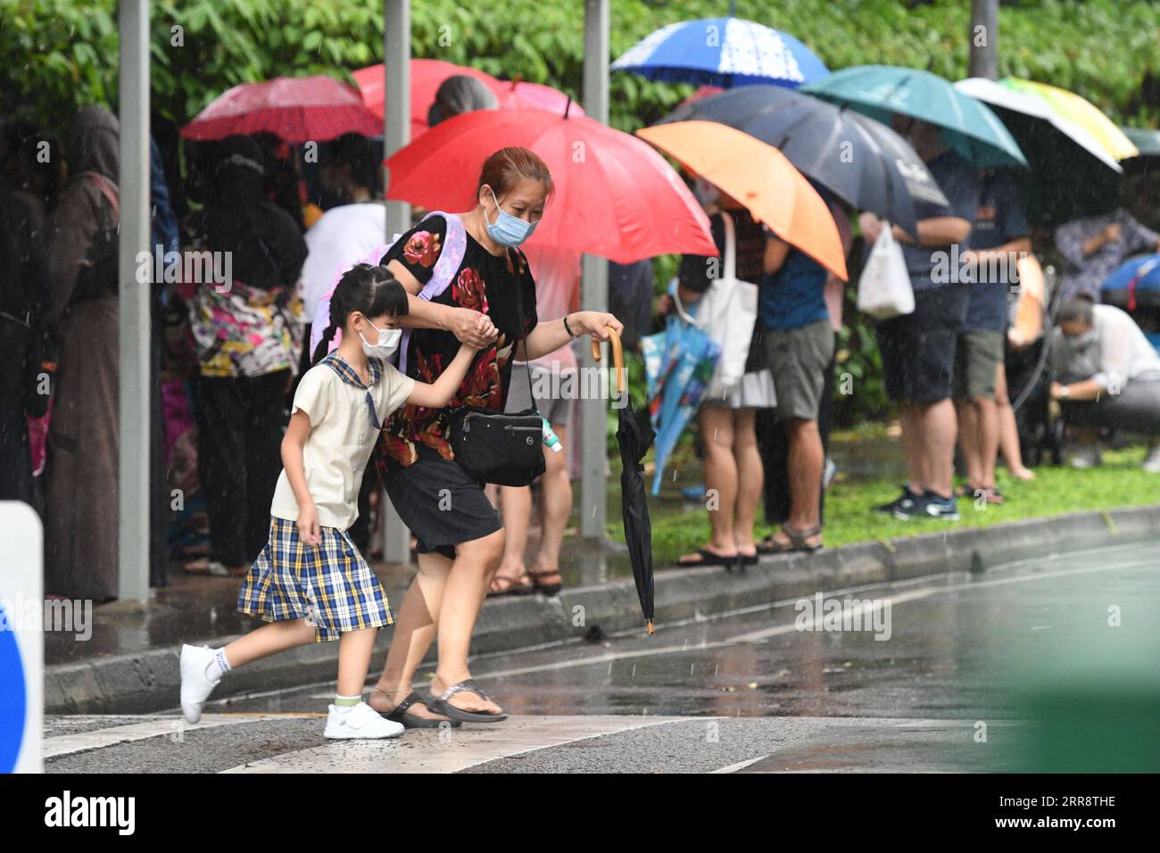 210518 -- SINGAPORE, May 18, 2021 -- Pupils leave their school after class in Singapore, May 18 ...