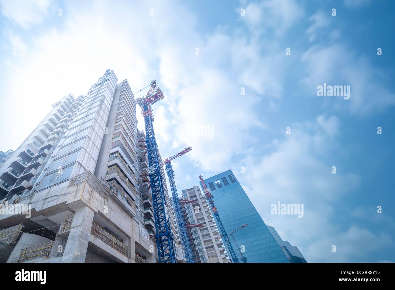 Concrete Highrise Construction Site with blue sky Stock Photo - Alamy