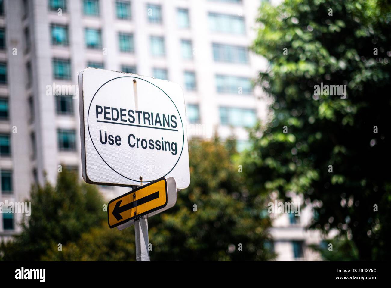 Pedestrian crossing sign with white color Stock Photo - Alamy