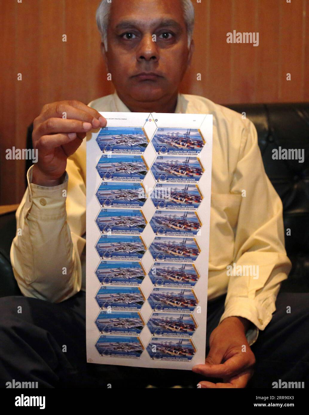 210522 -- ISLAMABAD, May 22, 2021 -- A Pakistan Post employee shows ...