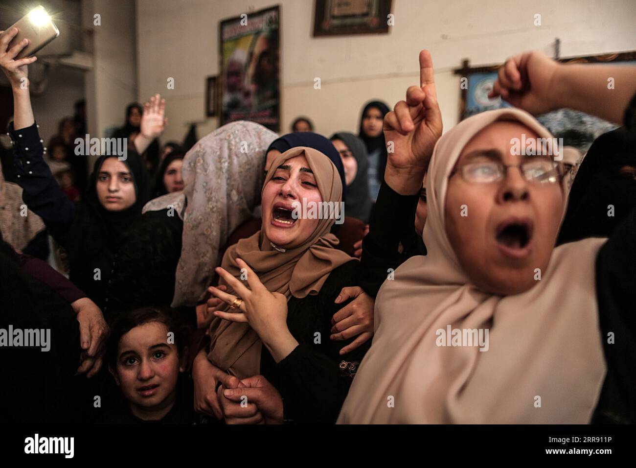 210522 -- GAZA, May 22, 2021 -- Palestinian women mourn during the ...