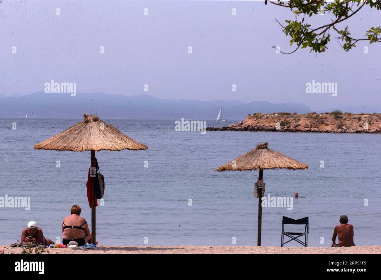 210523 -- ATHENS, May 23, 2021 -- People sunbathe along the beaches of ...