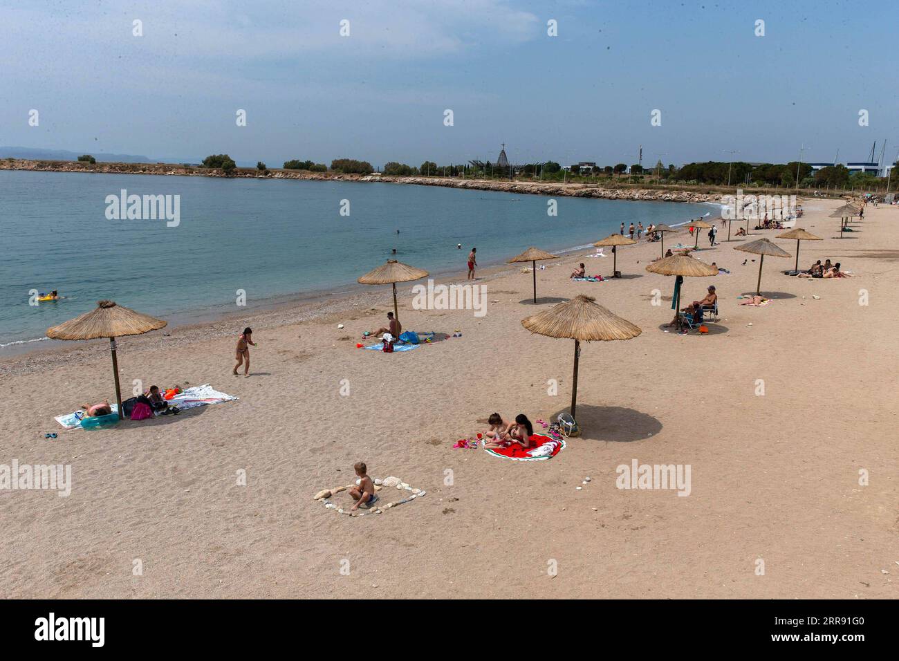 210523 -- ATHENS, May 23, 2021 -- People sunbathe along the beaches of ...