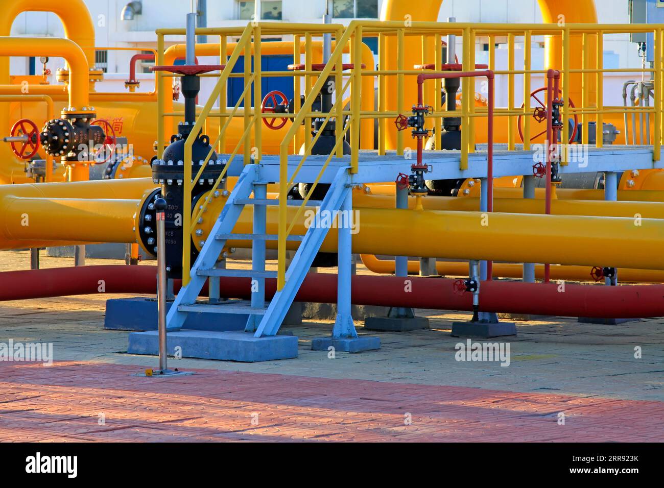 Oil refinery pipeline facilities, closeup of photo Stock Photo - Alamy