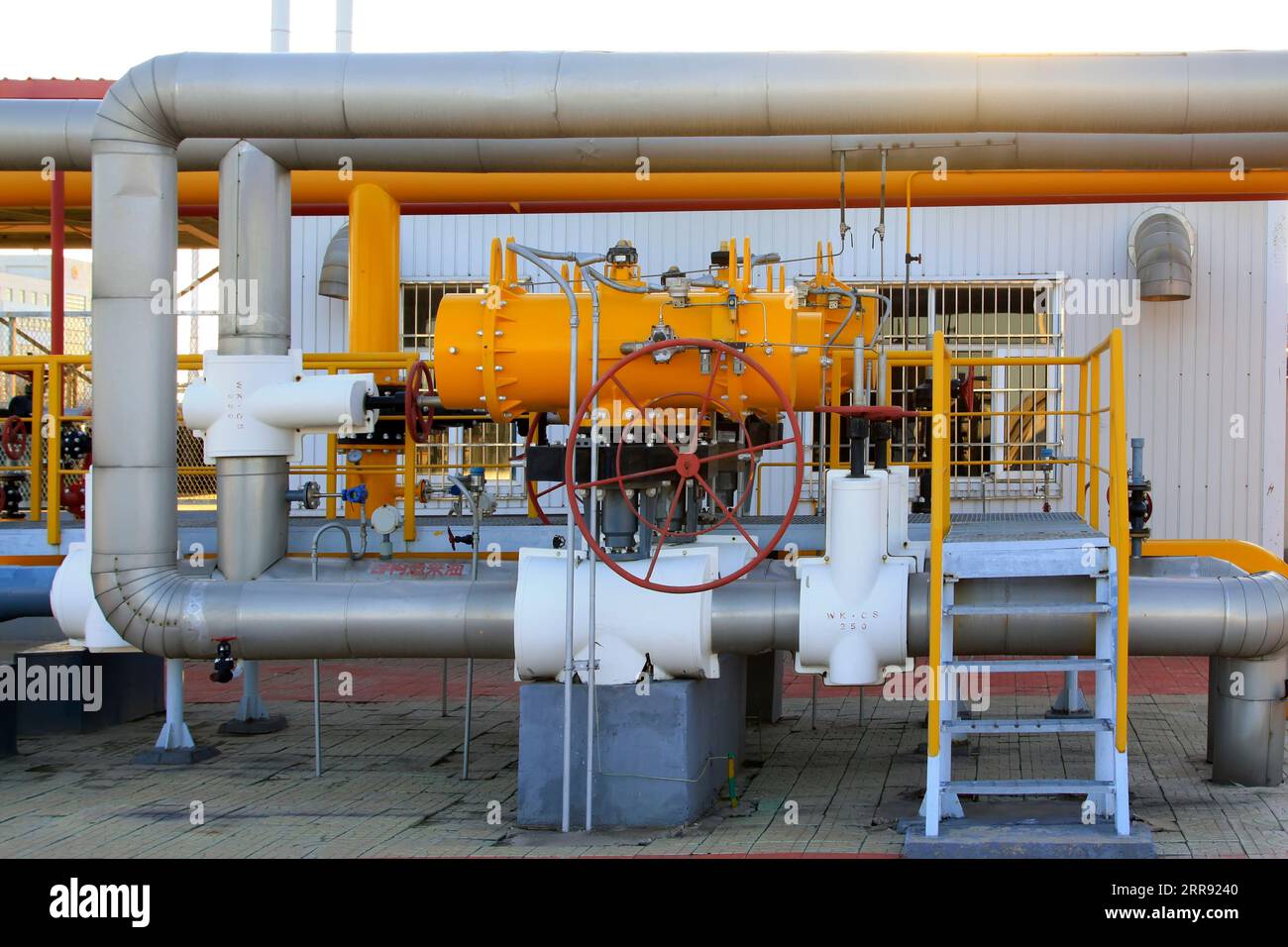 Oil refinery pipeline facilities, closeup of photo Stock Photo - Alamy