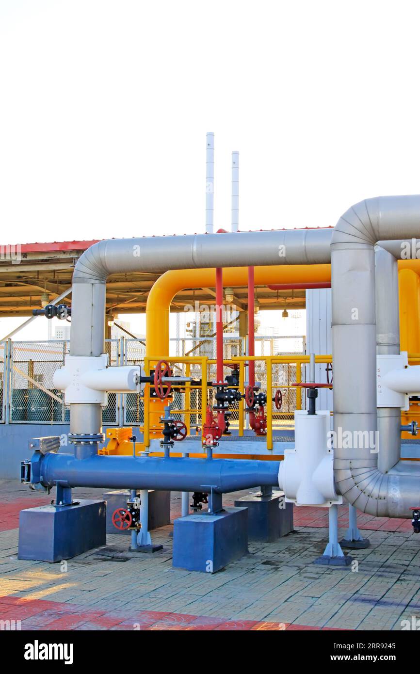 Oil refinery pipeline facilities, closeup of photo Stock Photo - Alamy