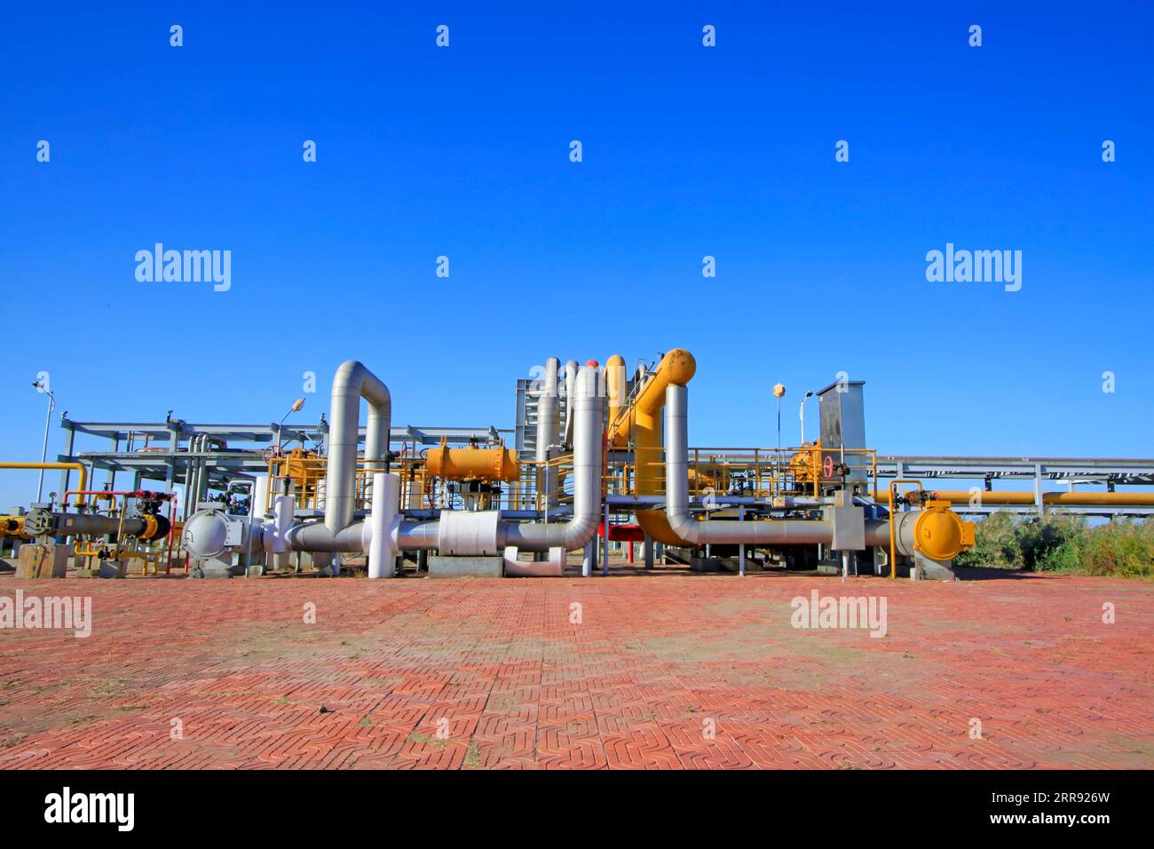 Refinery pipeline facilities, closeup of photo Stock Photo - Alamy