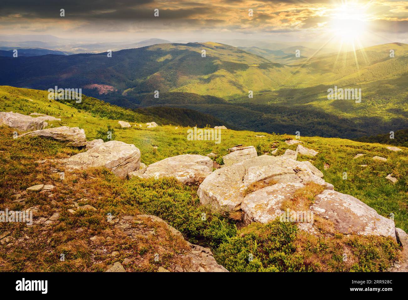 landscape with white sharp boulders on the hillside near mountain top ...