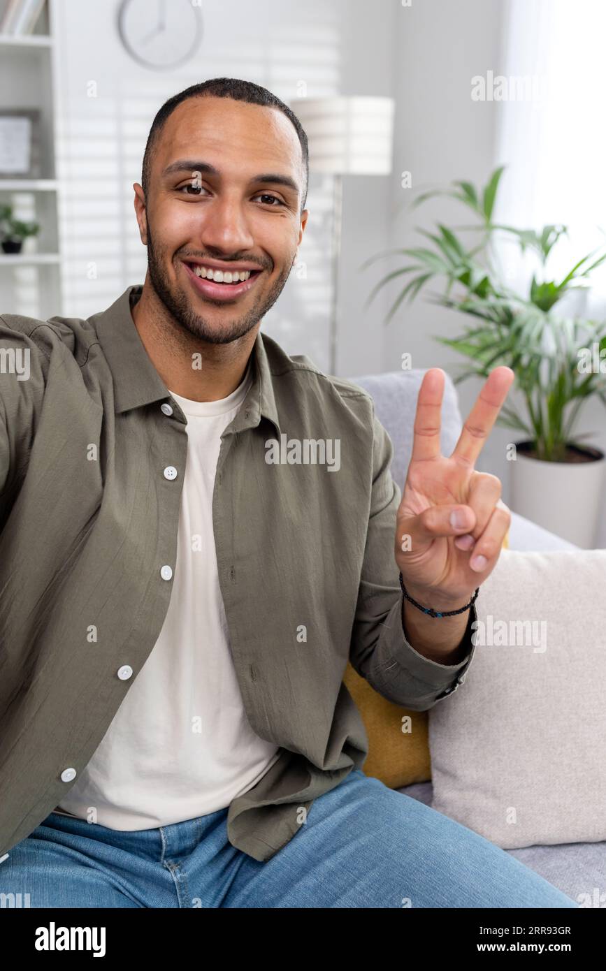 Vertical photo. Close-up photo of a smiling African-American man on a ...