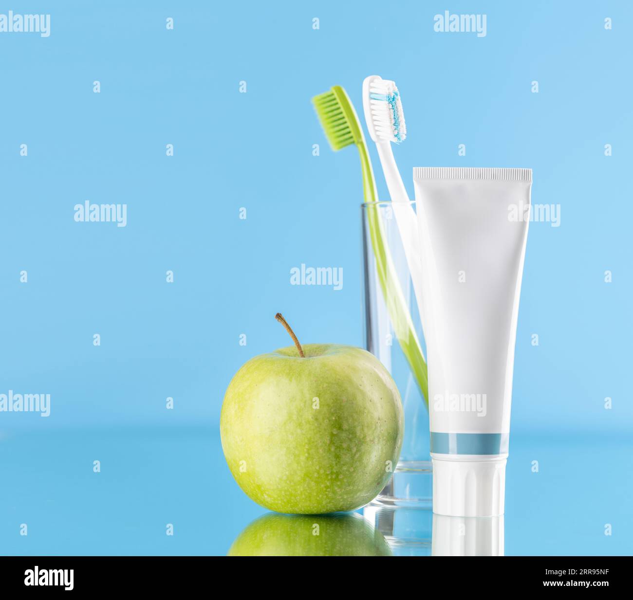 A clean and refreshing image featuring toothpaste and toothbrushes ...