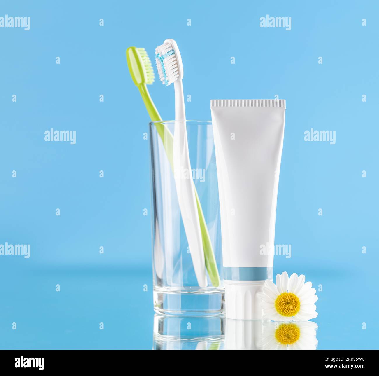 A clean and refreshing image featuring toothpaste and toothbrushes ...