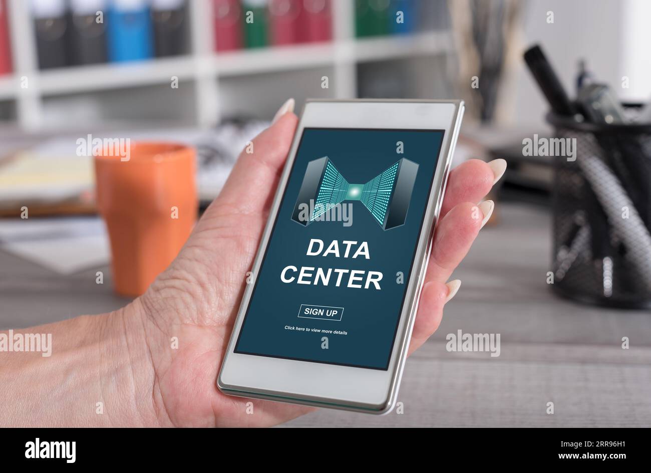 Female hand holding a smartphone with data center concept Stock Photo ...