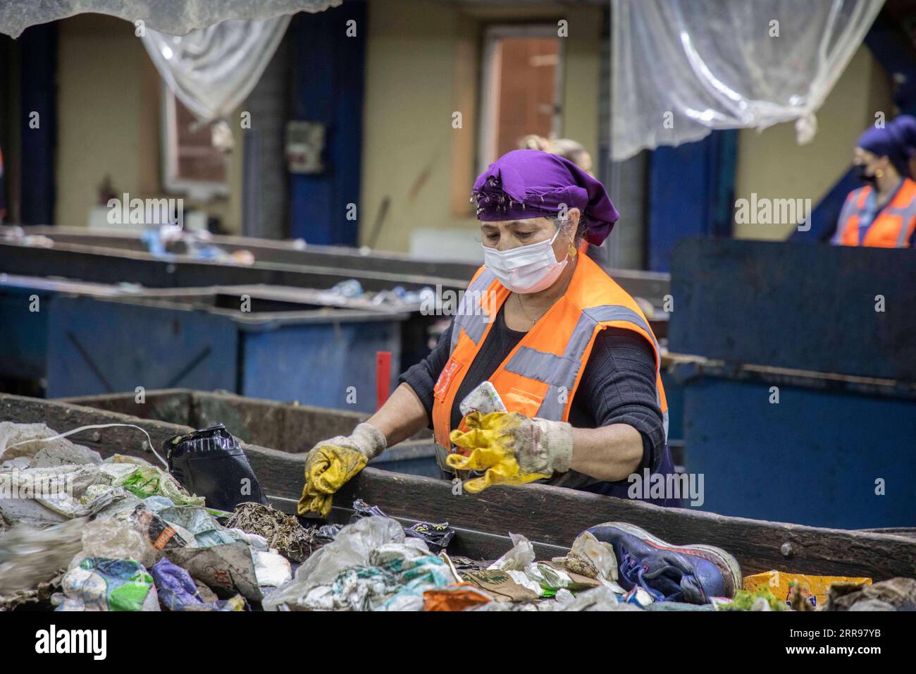 210601 -- ISTANBUL, June 1, 2021 -- Workers sort the waste at a ...