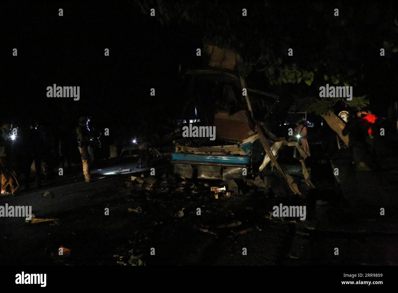 210601 -- KABUL, June 1, 2021 -- Security personnel inspect a damaged ...
