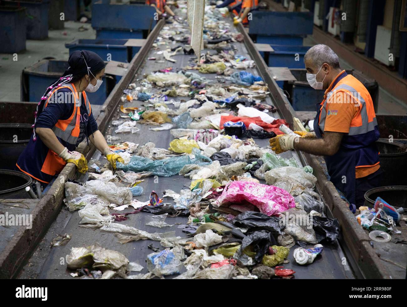 210601 -- ISTANBUL, June 1, 2021 -- Workers sort the waste at a ...