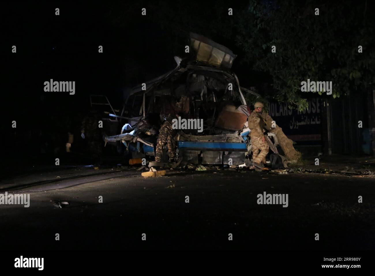 210601 -- KABUL, June 1, 2021 -- Security personnel inspect a damaged ...