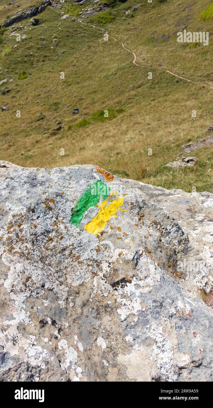 colored yellow green line marked walking path sign and hiking trails ...