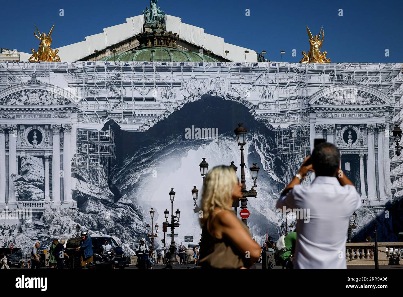 A man pictures the Opera Garnier Thursday, Sept. 7, 2023 in Paris ...