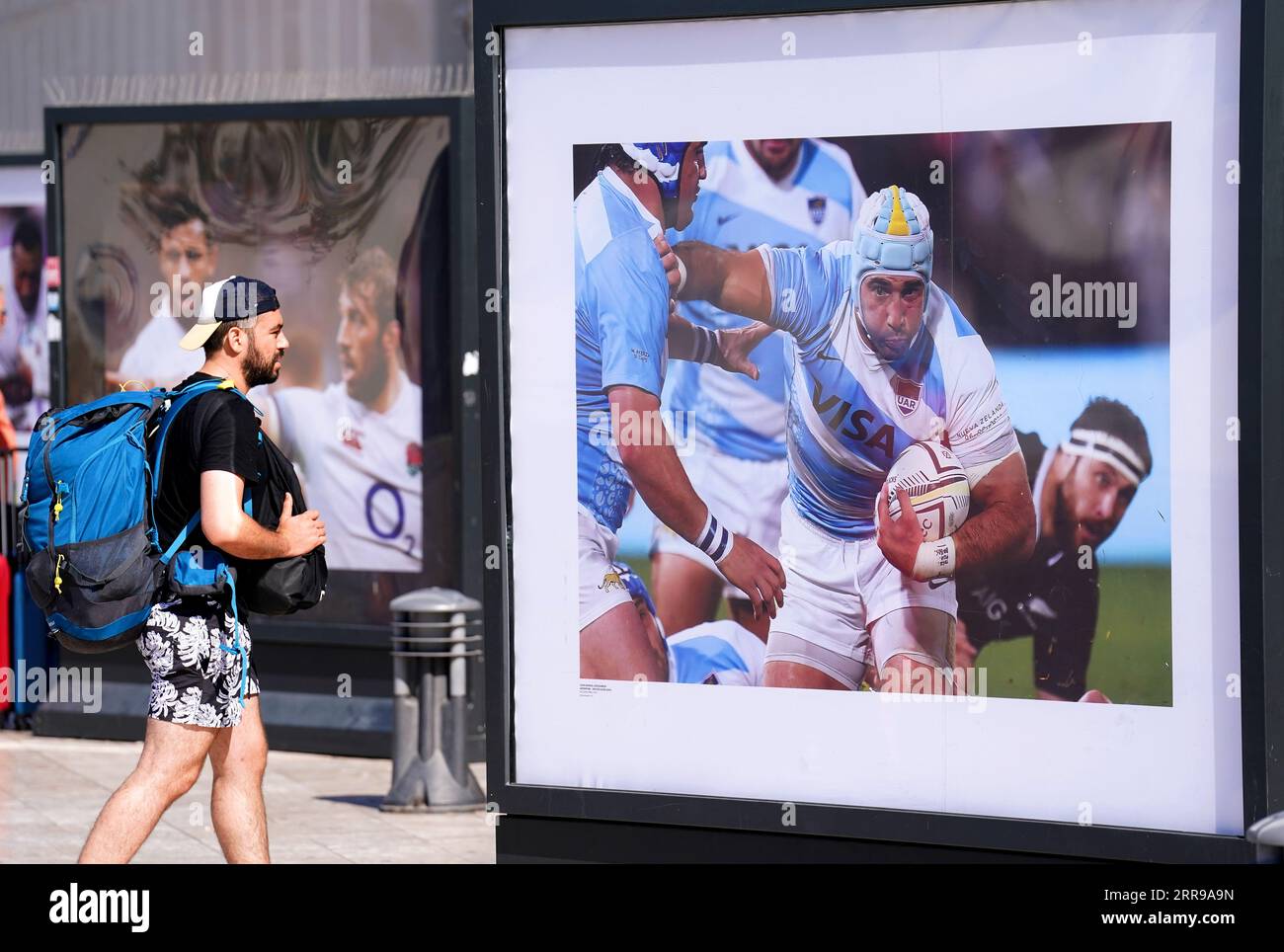 A person looks at a billboard of former Argentina rugby player Juan ...