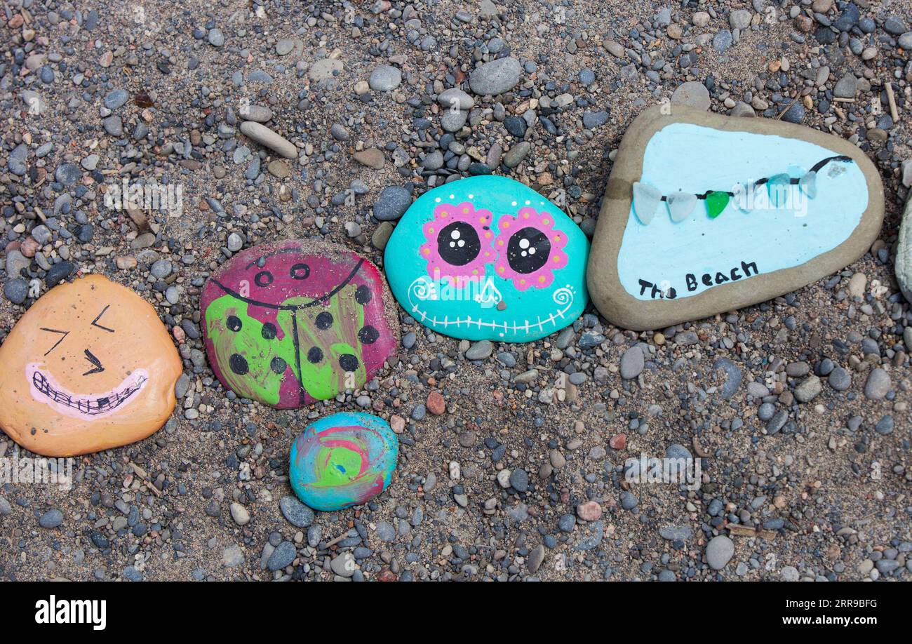 210608 -- TORONTO, June 8, 2021 -- Painted rocks arranged in a line are ...