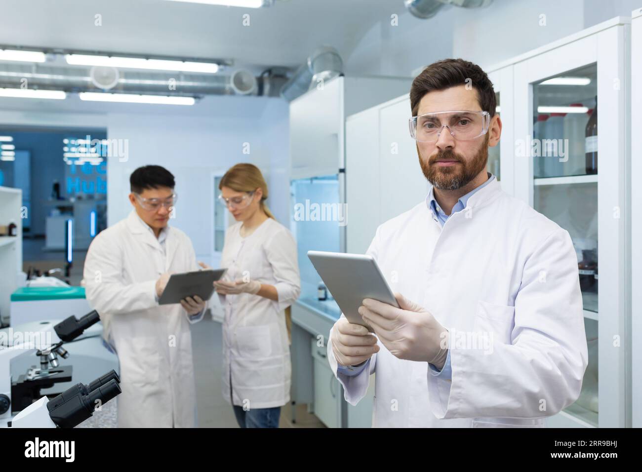 Scientist searching looking microscope hi-res stock photography and ...