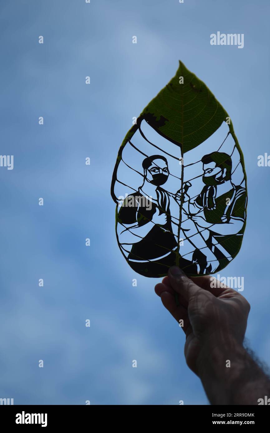 210611 -- AGARTALA, June 11, 2021 -- Leaf artist Subham Saha shows his ...