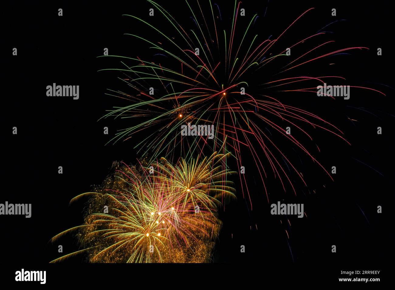 Colorful fireworks exploded in the night sky Stock Photo - Alamy