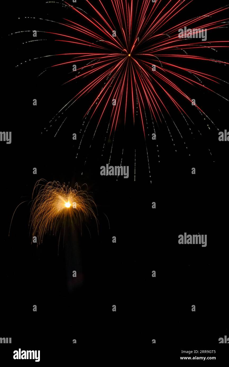 Colorful fireworks exploded in the night sky Stock Photo - Alamy