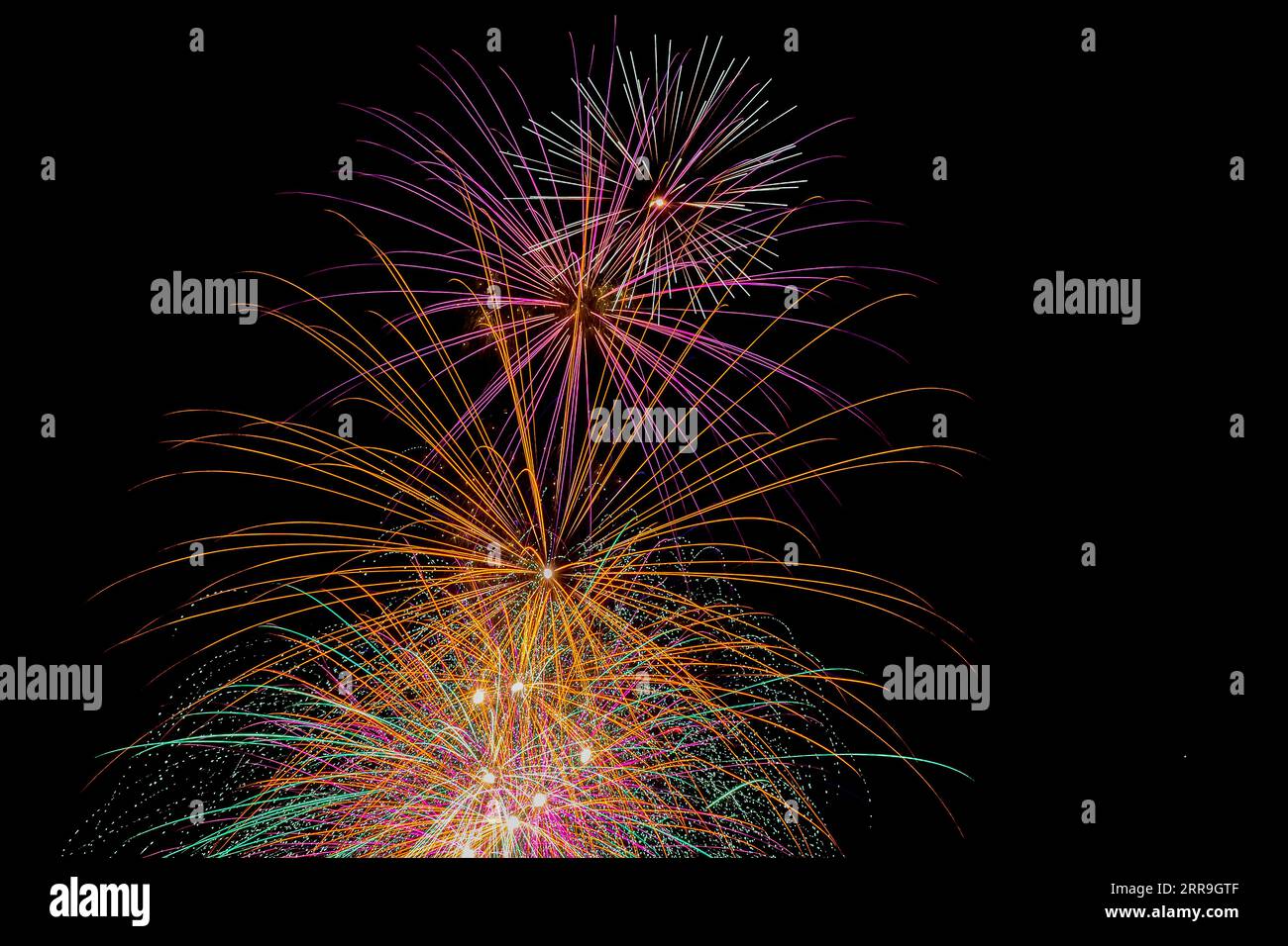 Colorful fireworks exploded in the night sky Stock Photo - Alamy