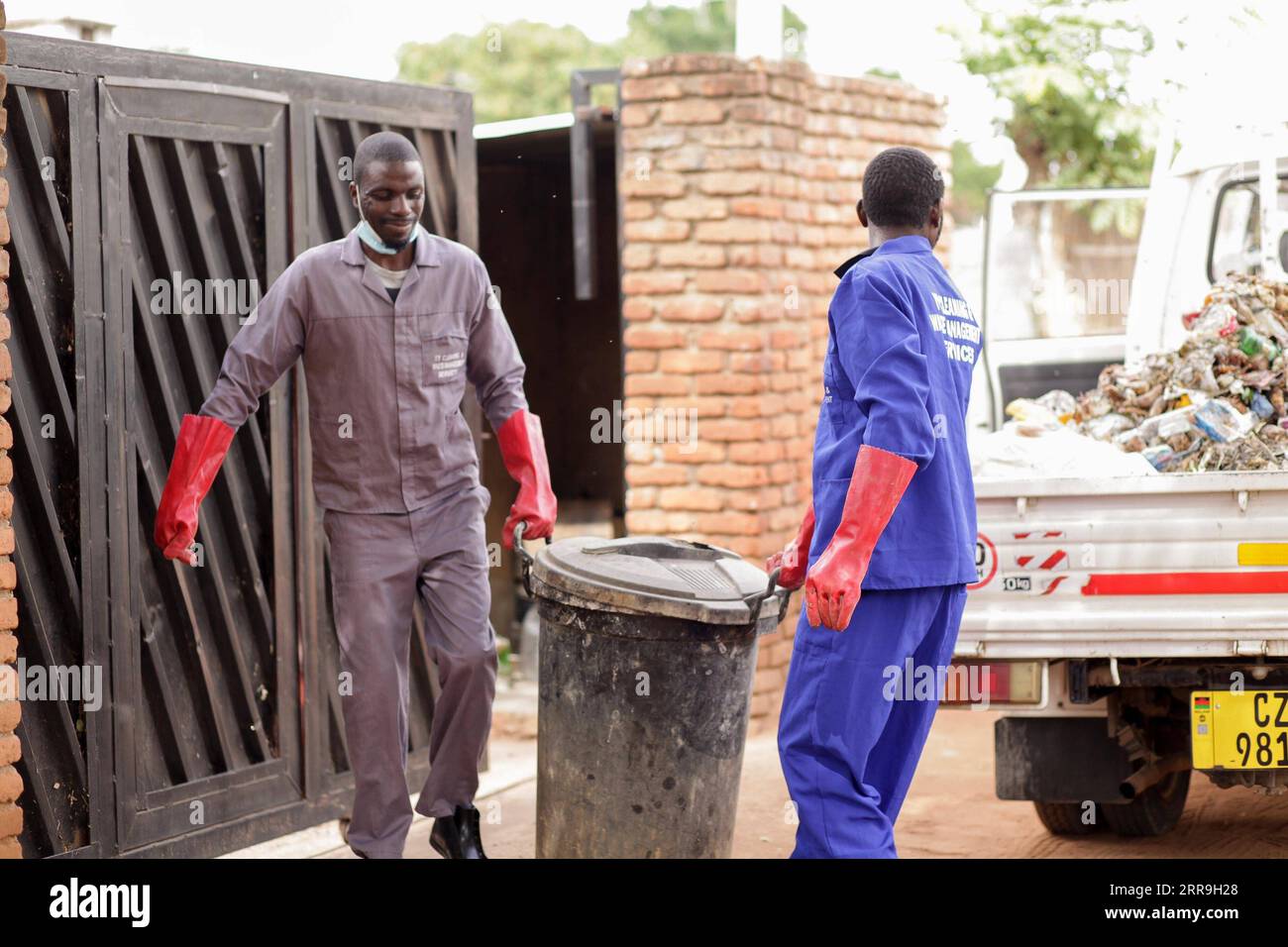 210617 -- BLANTYRE, June 17, 2021 -- Dave Mwenda L and his colleague ...