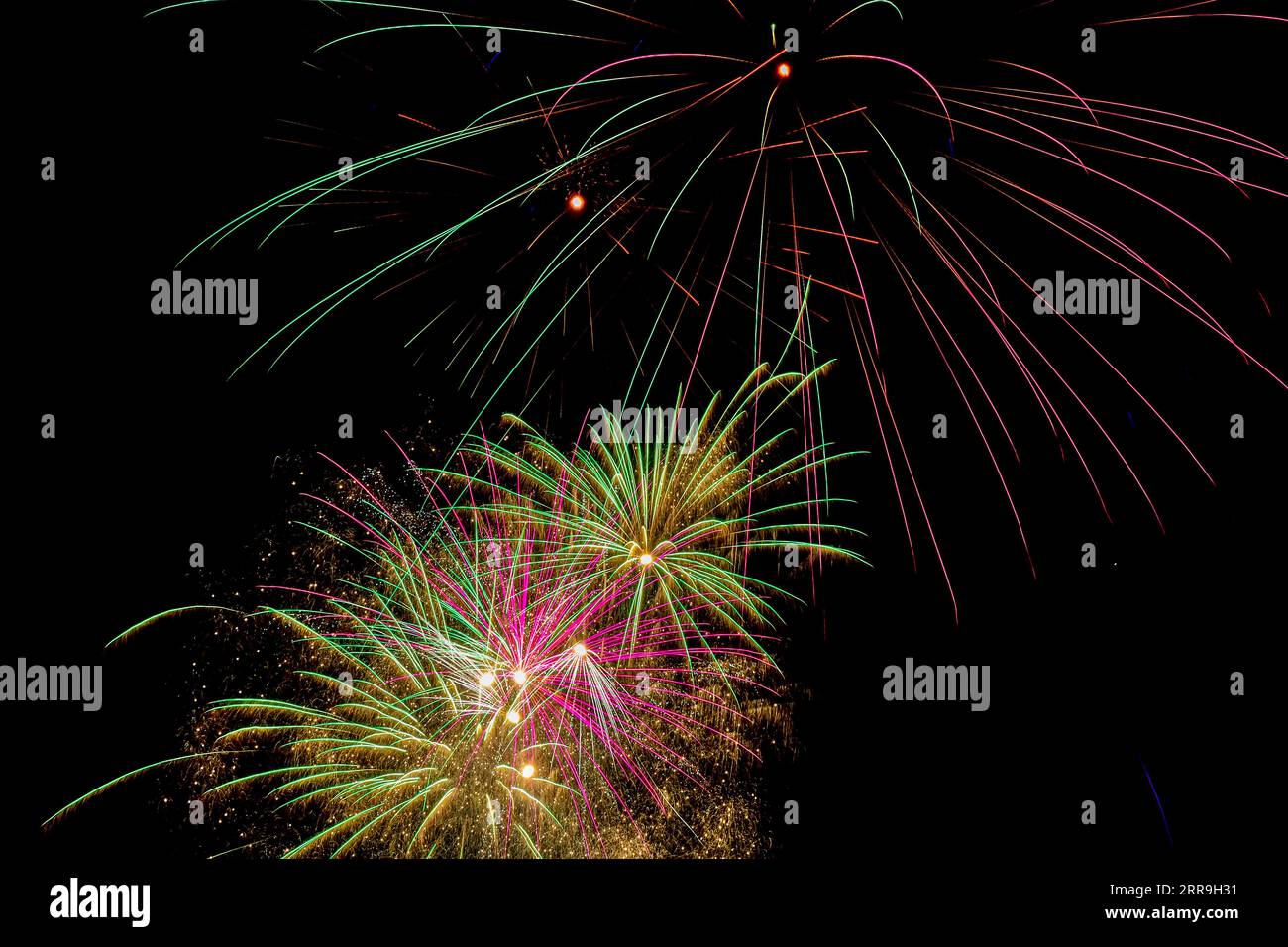 Colorful fireworks exploded in the night sky Stock Photo - Alamy