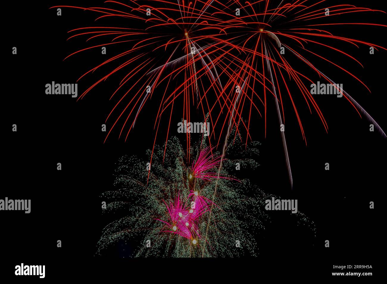 Colorful fireworks exploded in the night sky Stock Photo - Alamy