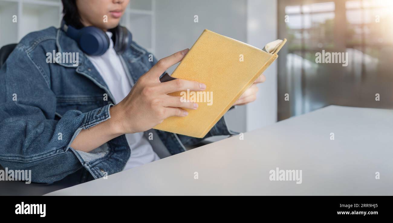 Young guy opened book hi-res stock photography and images - Alamy